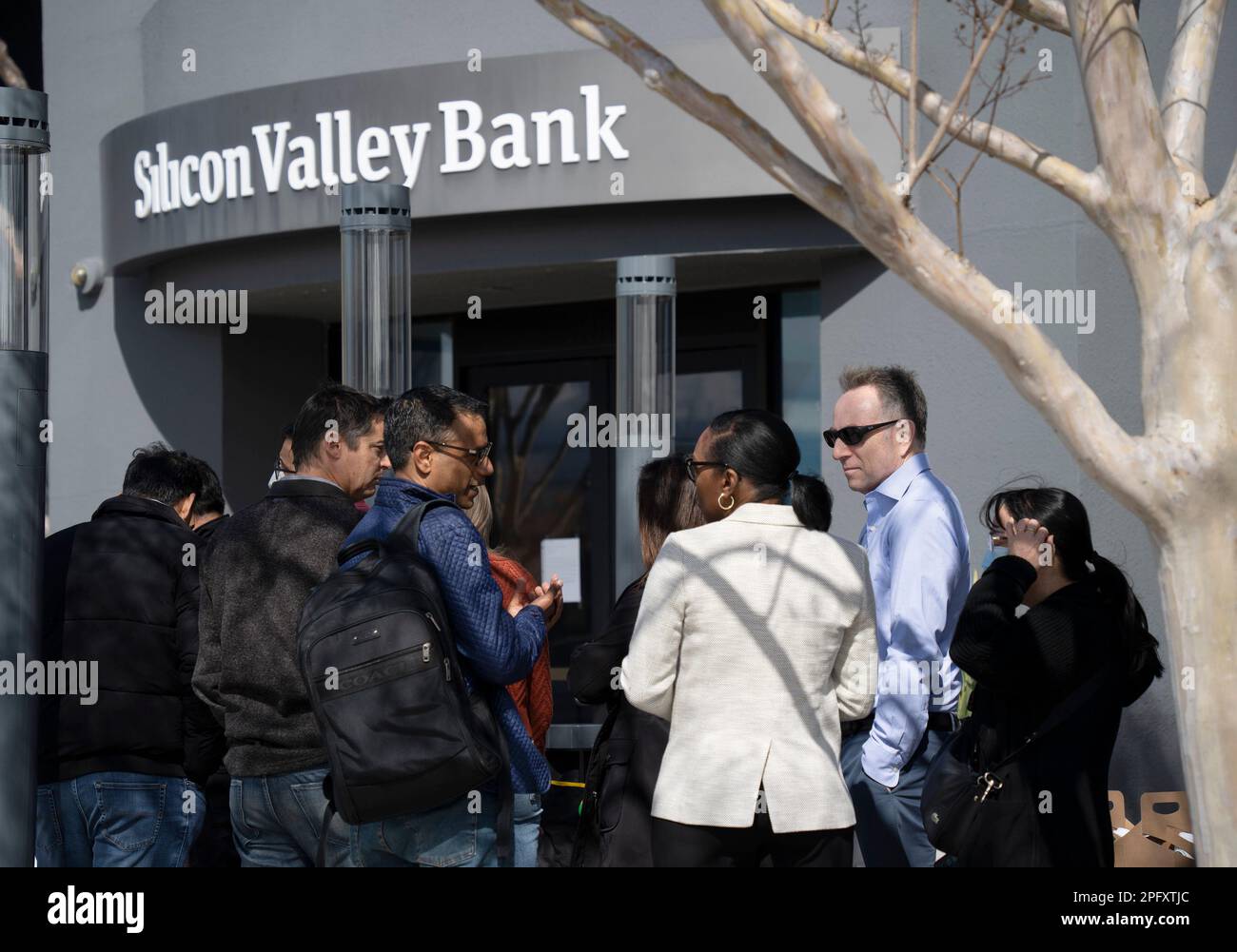 New York, USA. 13th Mar, 2023. People queue up outside the headquarters ...
