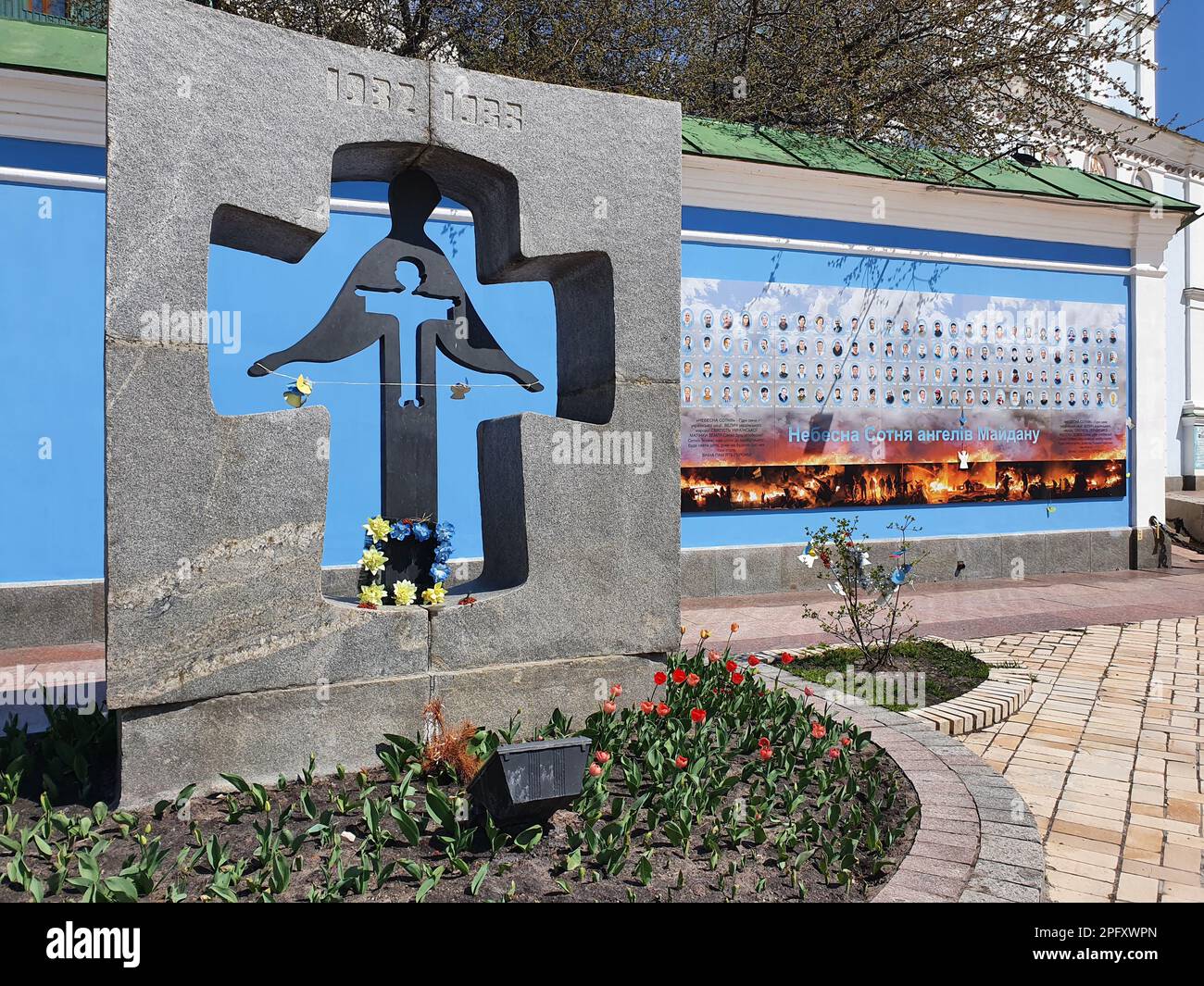The photo depicts the Memorial to the victims of Holodomor and the Wall ...