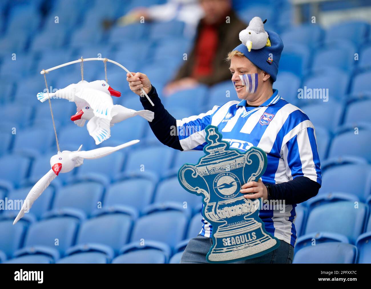 A Brighton fan with a seagull mobile in the stands ahead of the ...