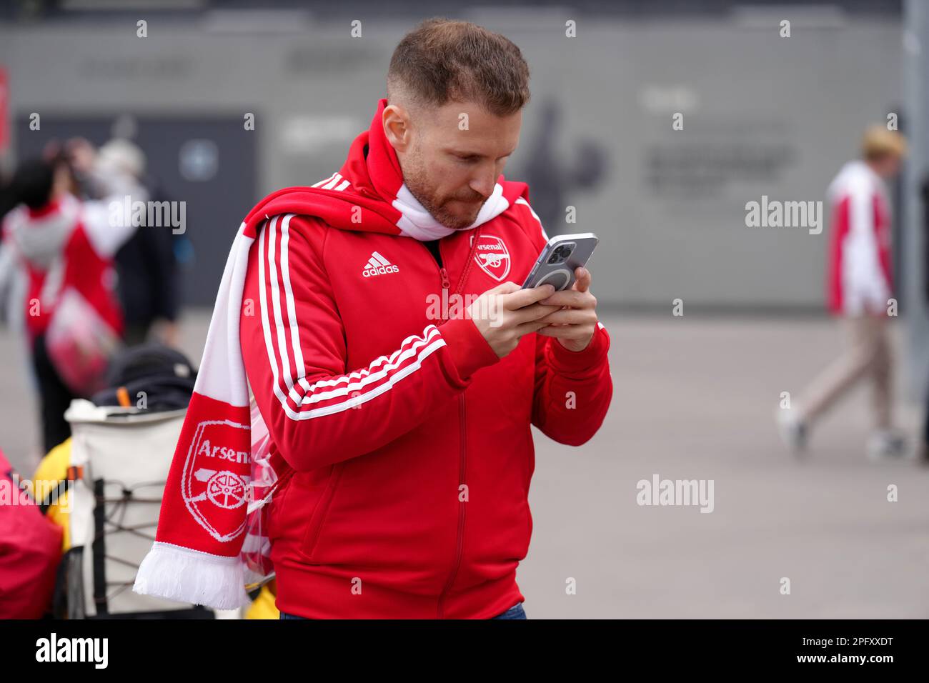 An Arsenal fan outside the ground before the Premier League match at ...