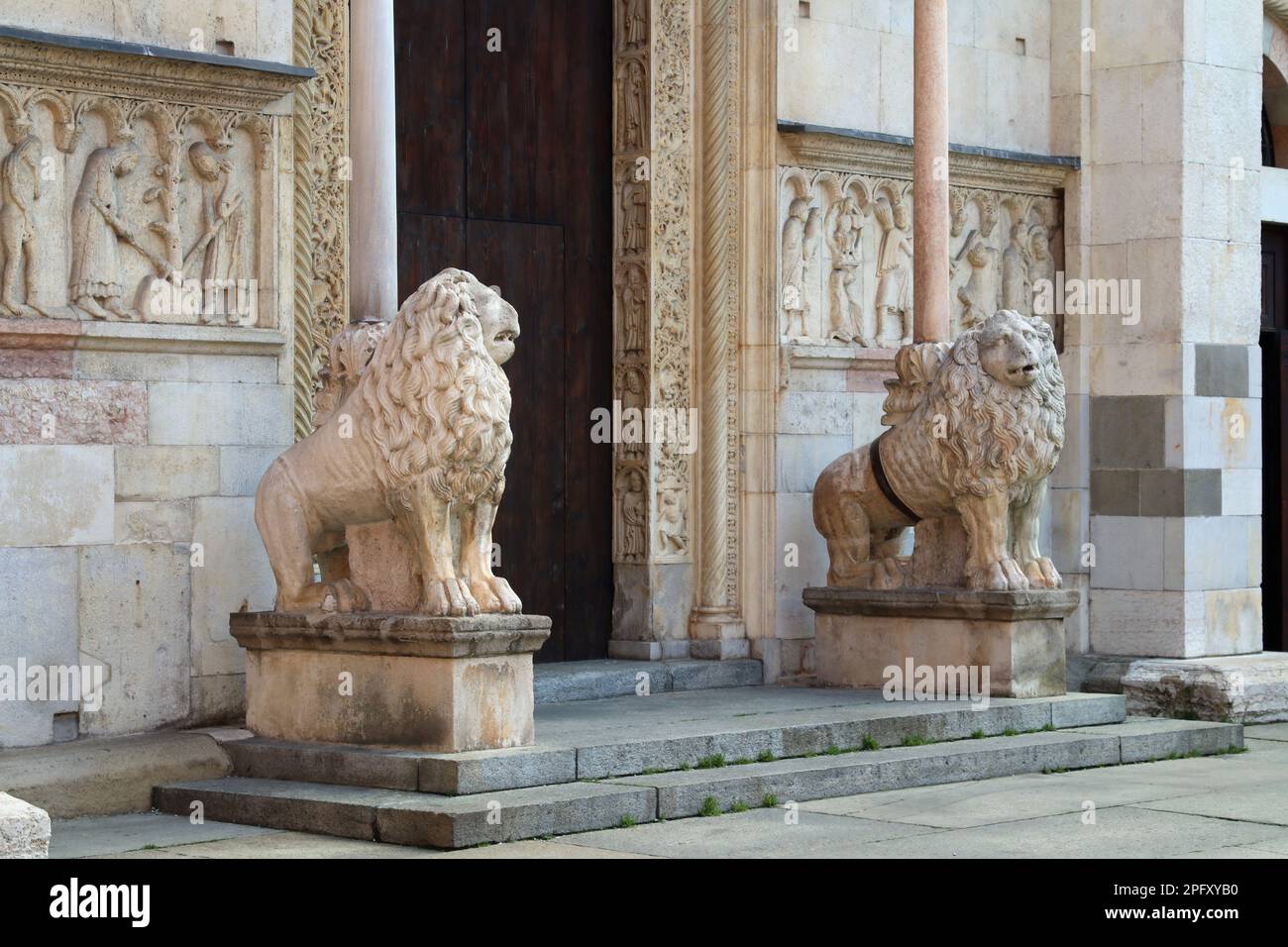 Modena cathedral, detail of the entrance with Romanesque column-bearing ...