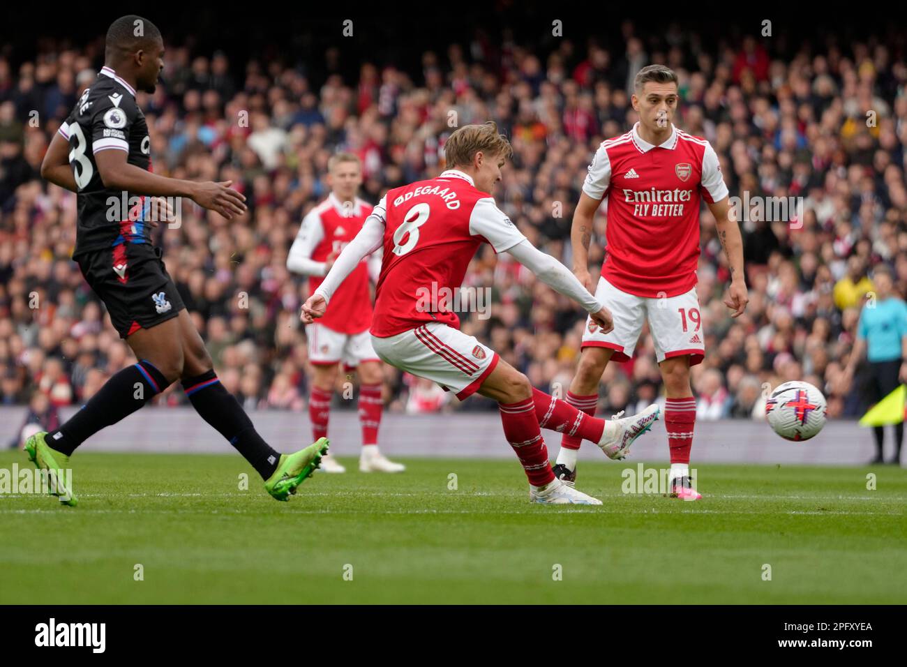 Arsenal's Martin Odegaard, centre, makes an attempt to score during the ...