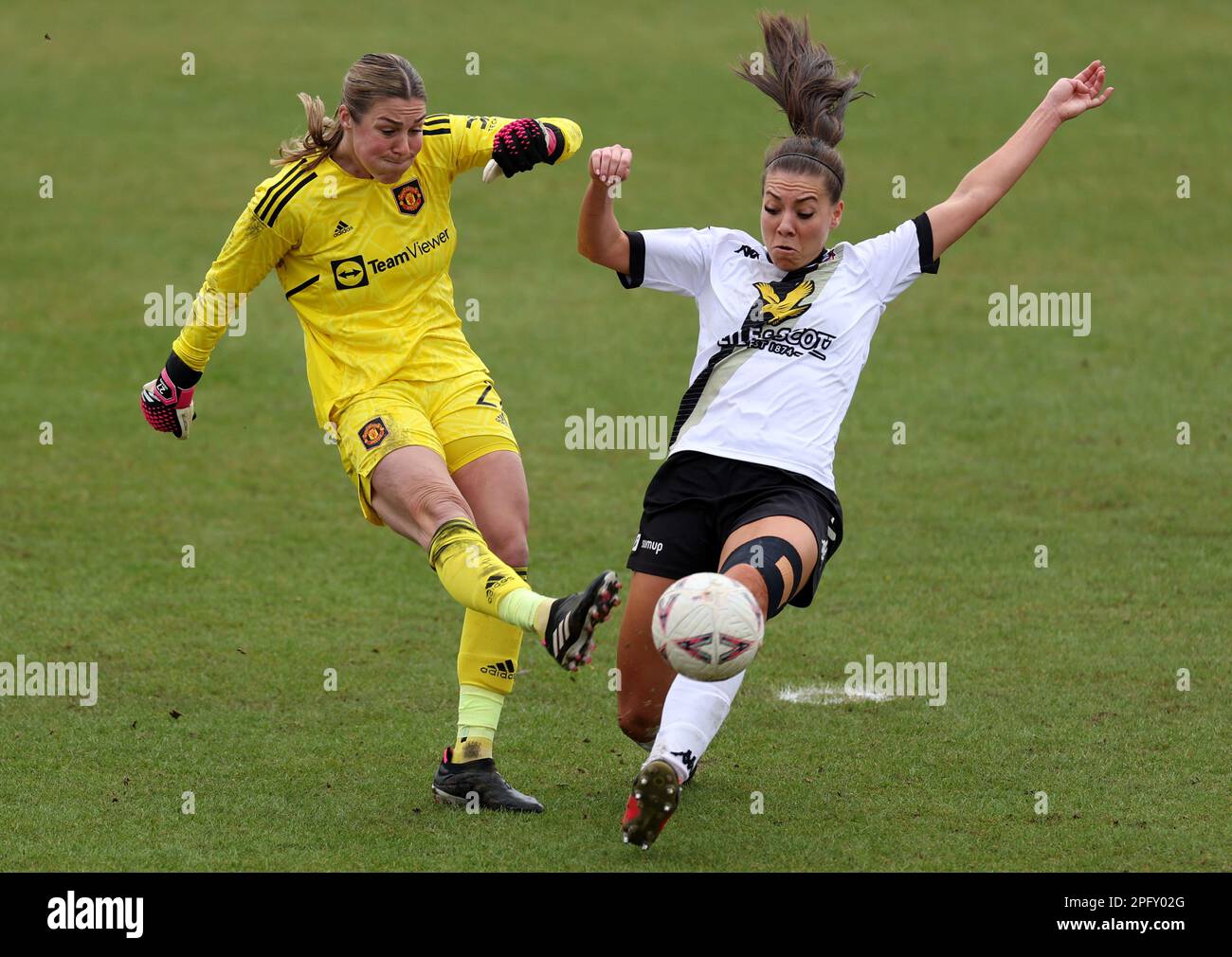 Manchester United goalkeeper Mary Earps (left) and Lewes' Ellie Mason ...