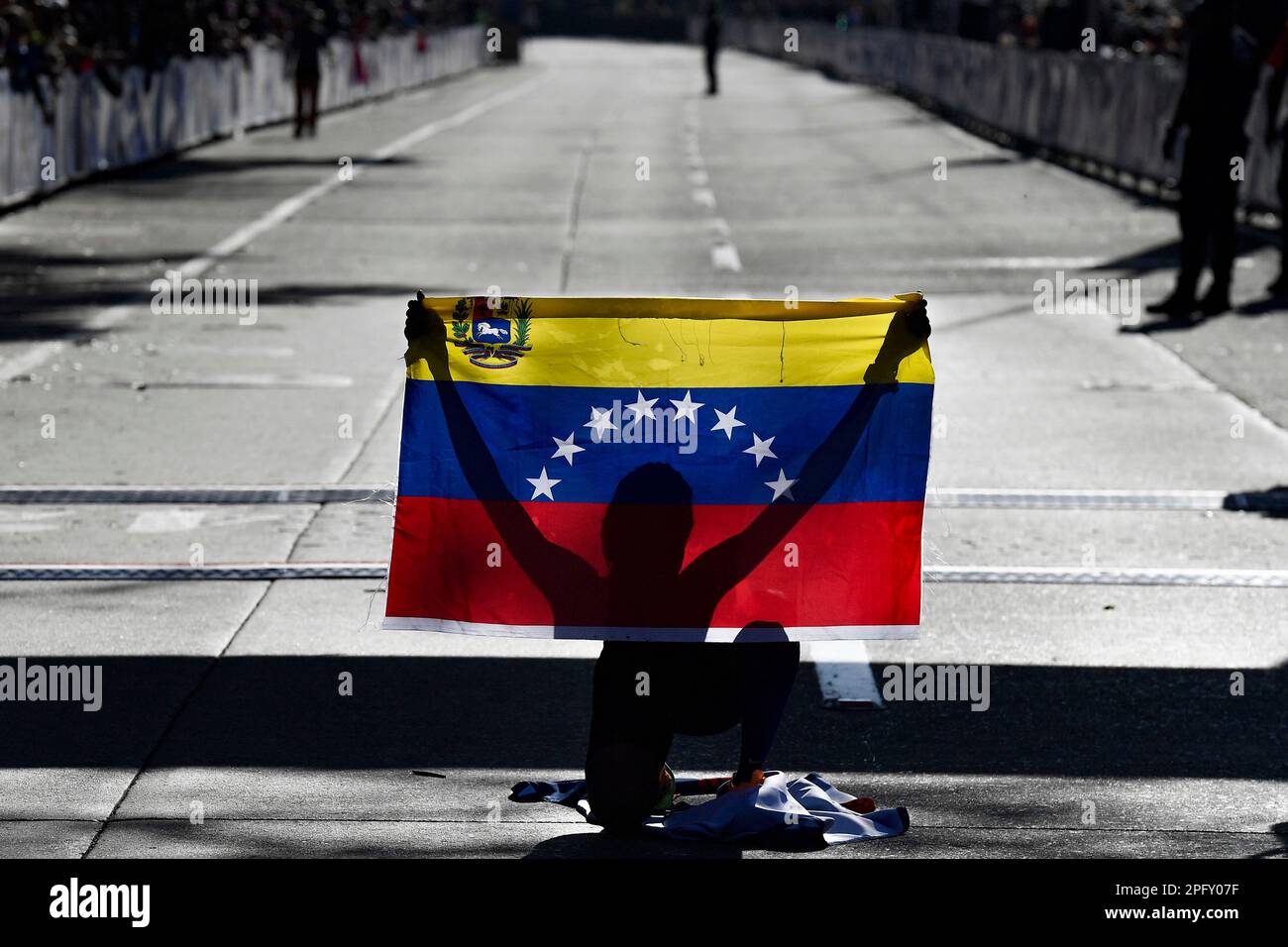 Venezuelan runner Magaly Garcia celebrates his first place holding a ...