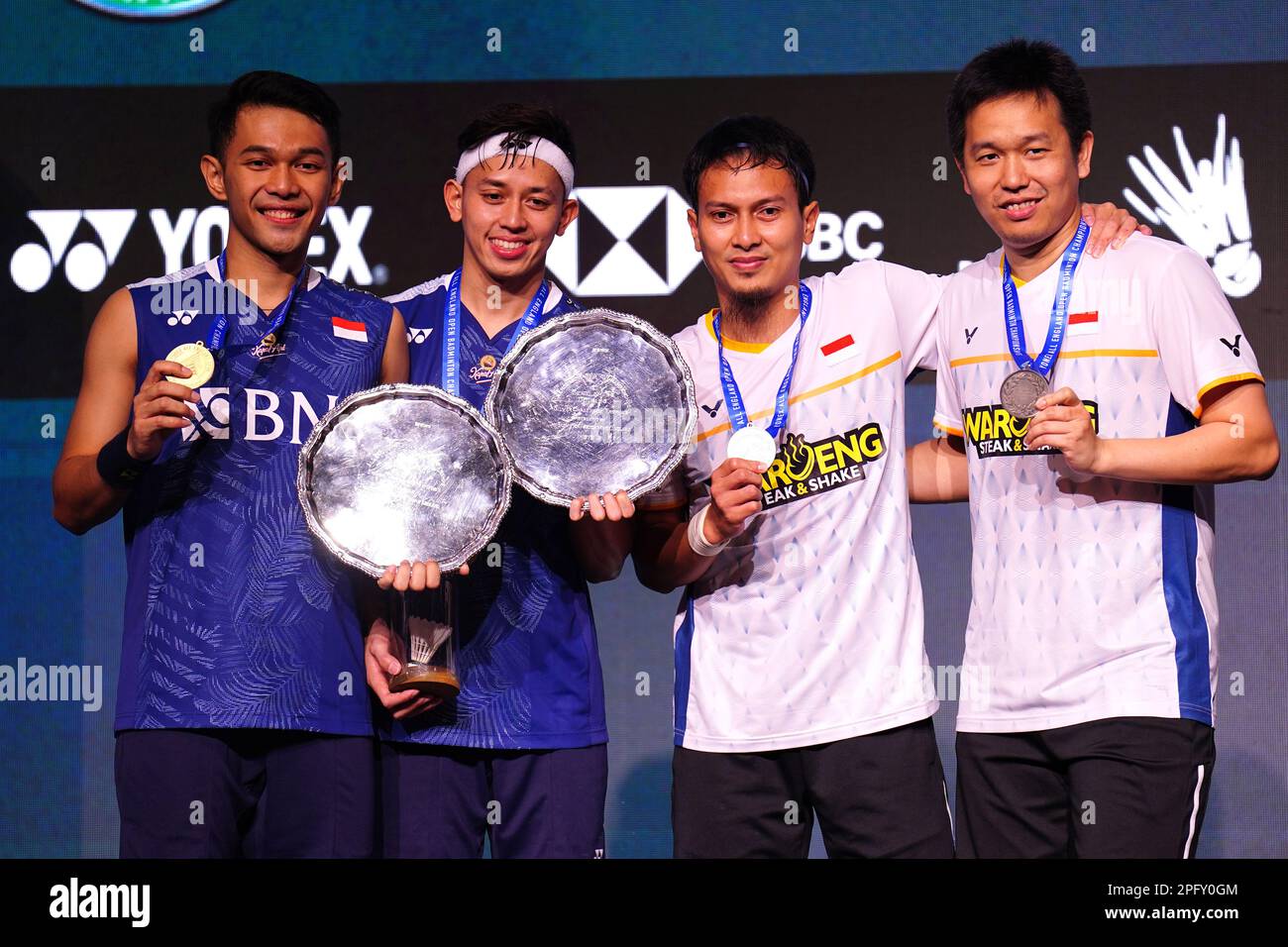 Indonesia's Fajar Alfian (far left) and Muhammad Rian Ardianto (left) celebrate victory over ...