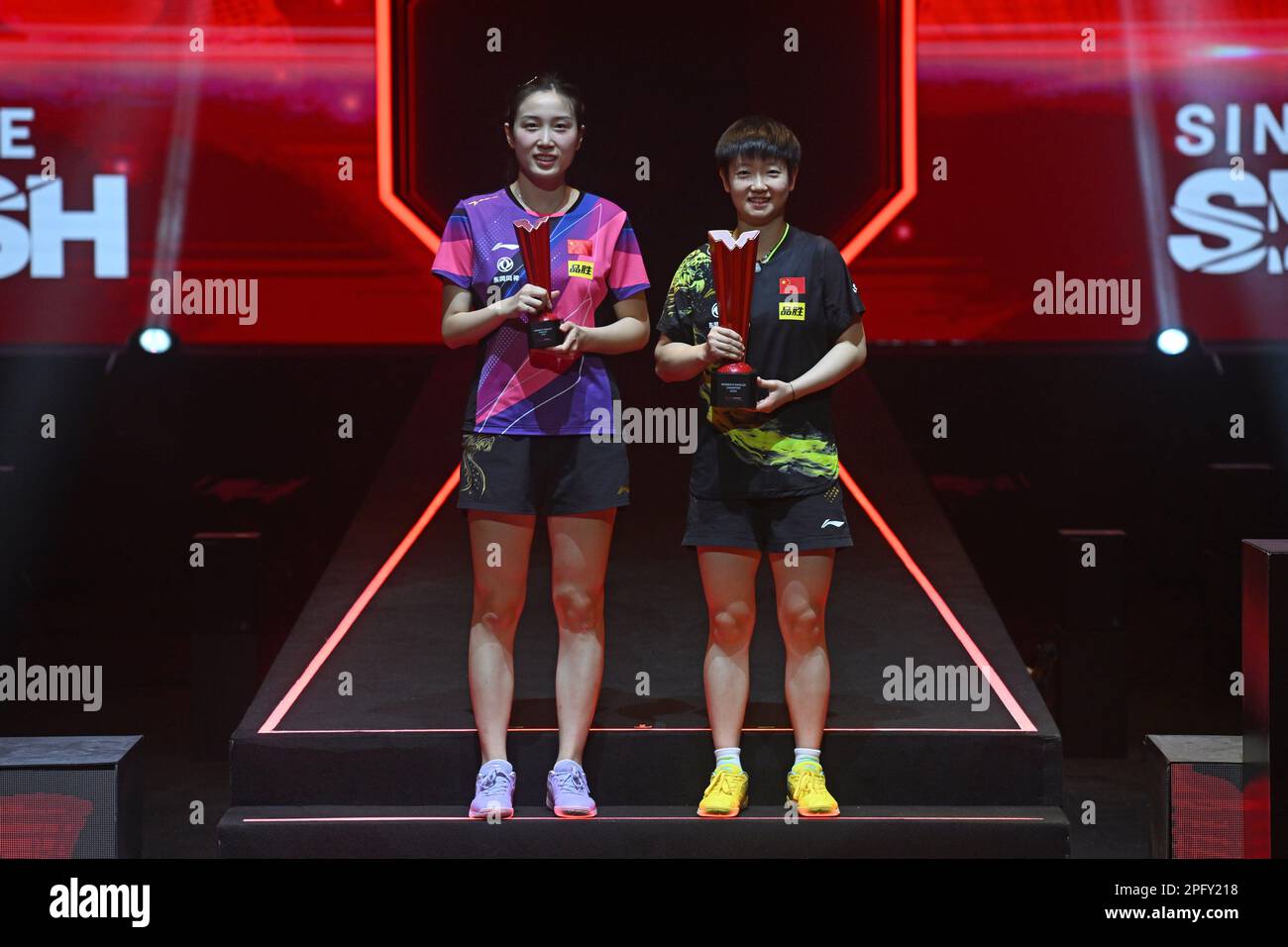 Singapore. 19th Mar, 2023. Sun Yingsha (R) and Qian Tianyi of China pose with the trophies ...