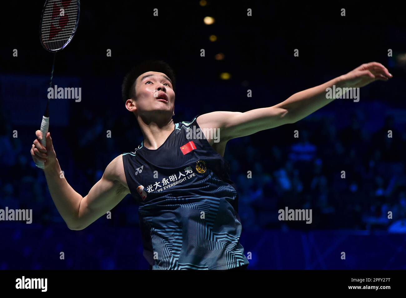 China's Li Shi Feng returns a shot during the men's final match against ...