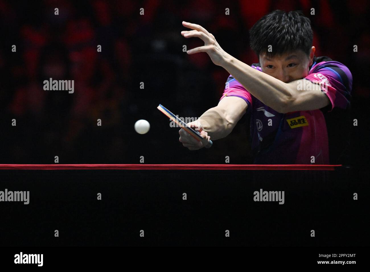 Singapore. 19th Mar, 2023. Ma Long hits a return during the men's ...