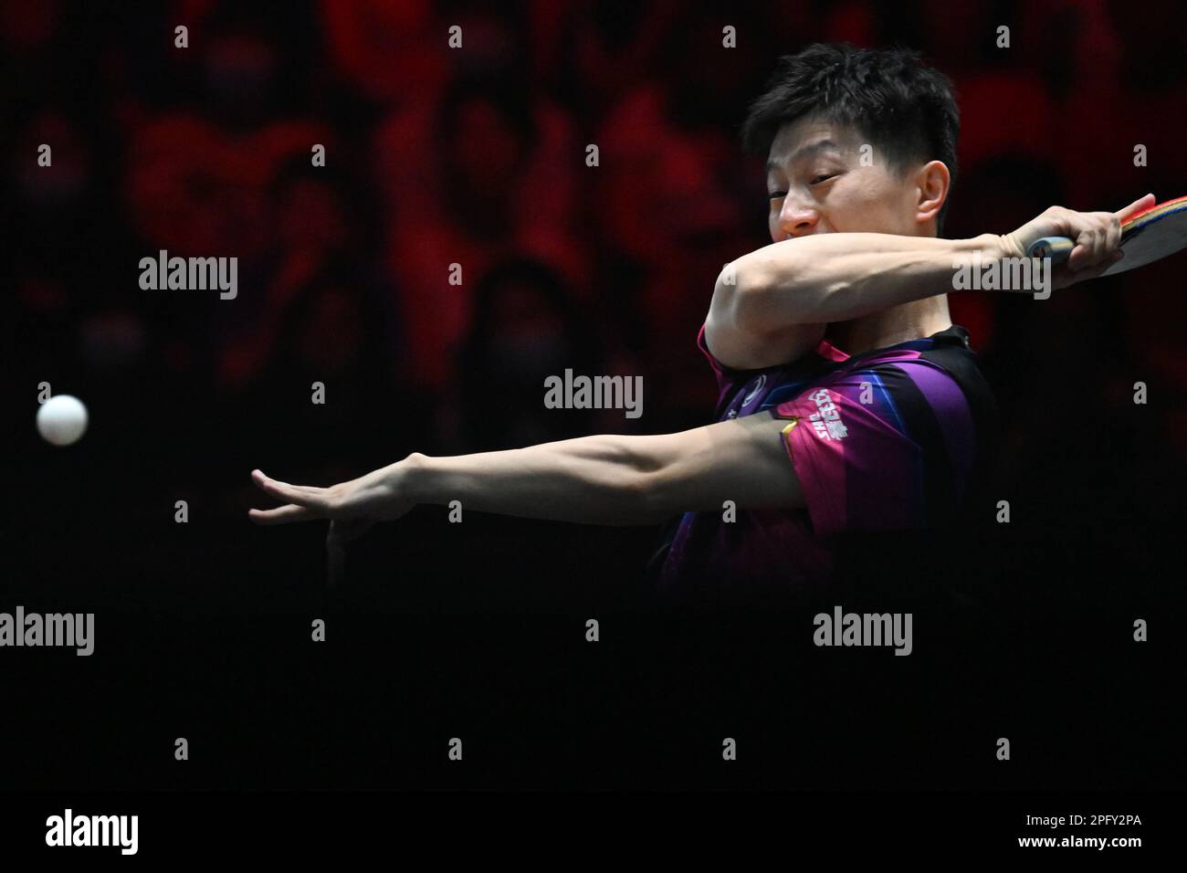 Singapore. 19th Mar, 2023. Ma Long hits a return during the men's ...