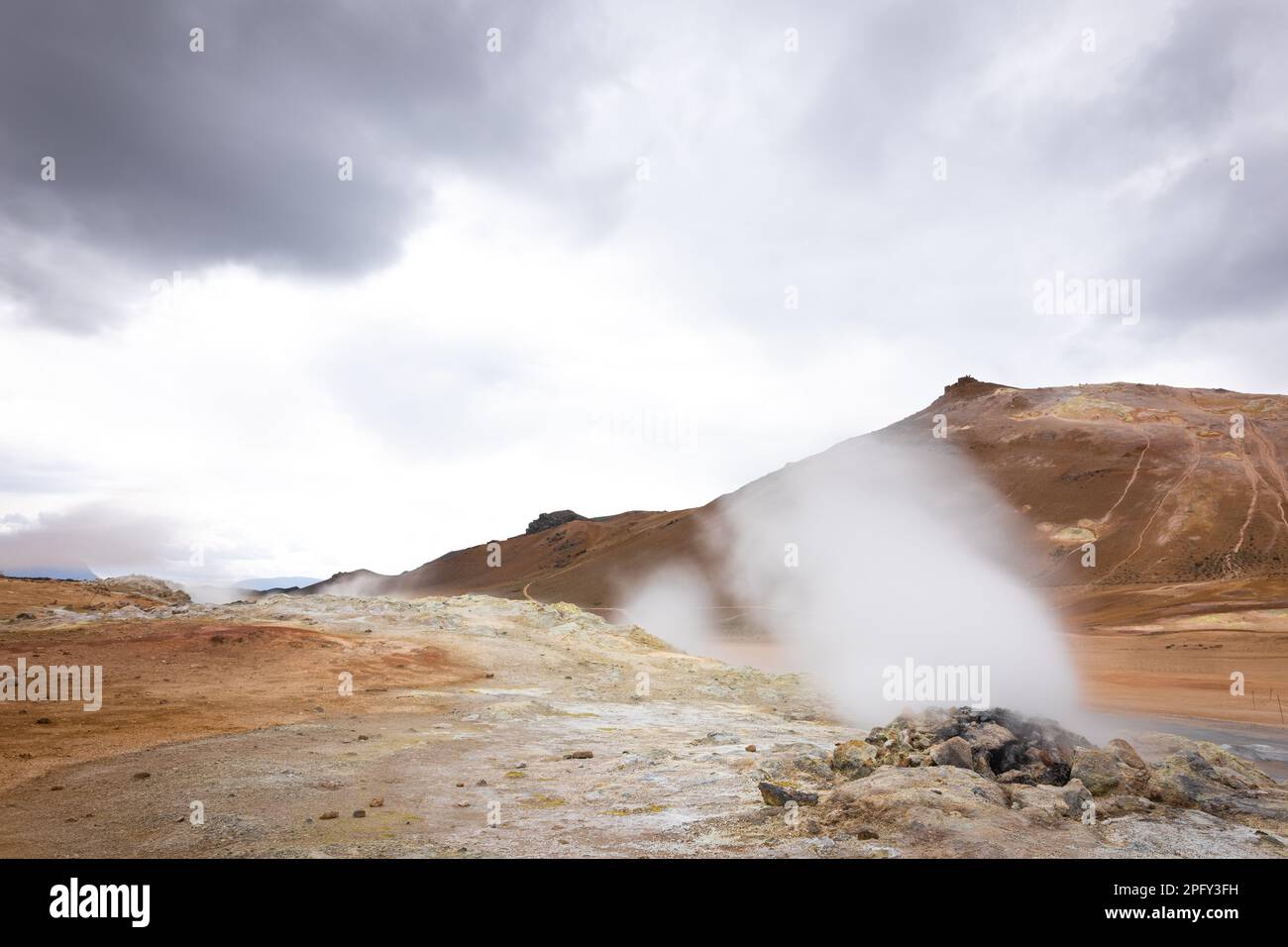 The steaming fumaroles from a geothermal spring at Hverir Stock Photo ...