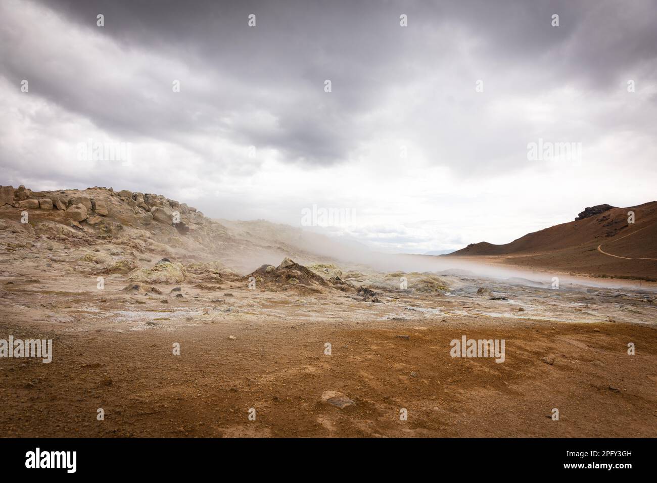 The steaming fumaroles from a geothermal spring at Hverir Stock Photo ...