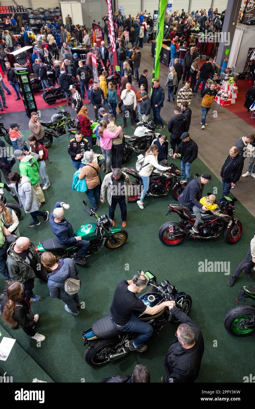 Erfurt, Germany. 19th Mar, 2023. Visitors look at the two-wheelers on ...
