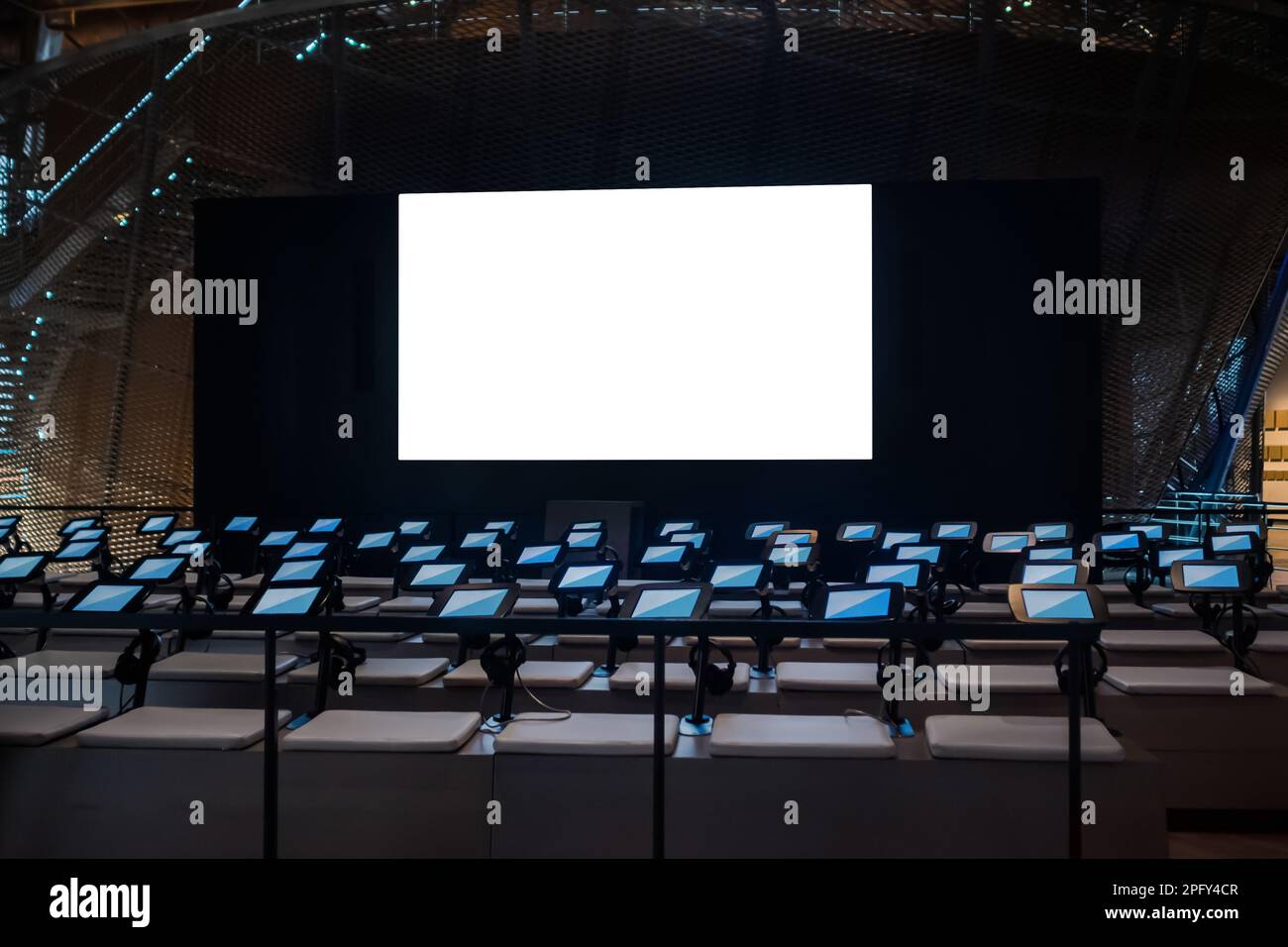 White screen concept - woman looking at blank interactive white display ...