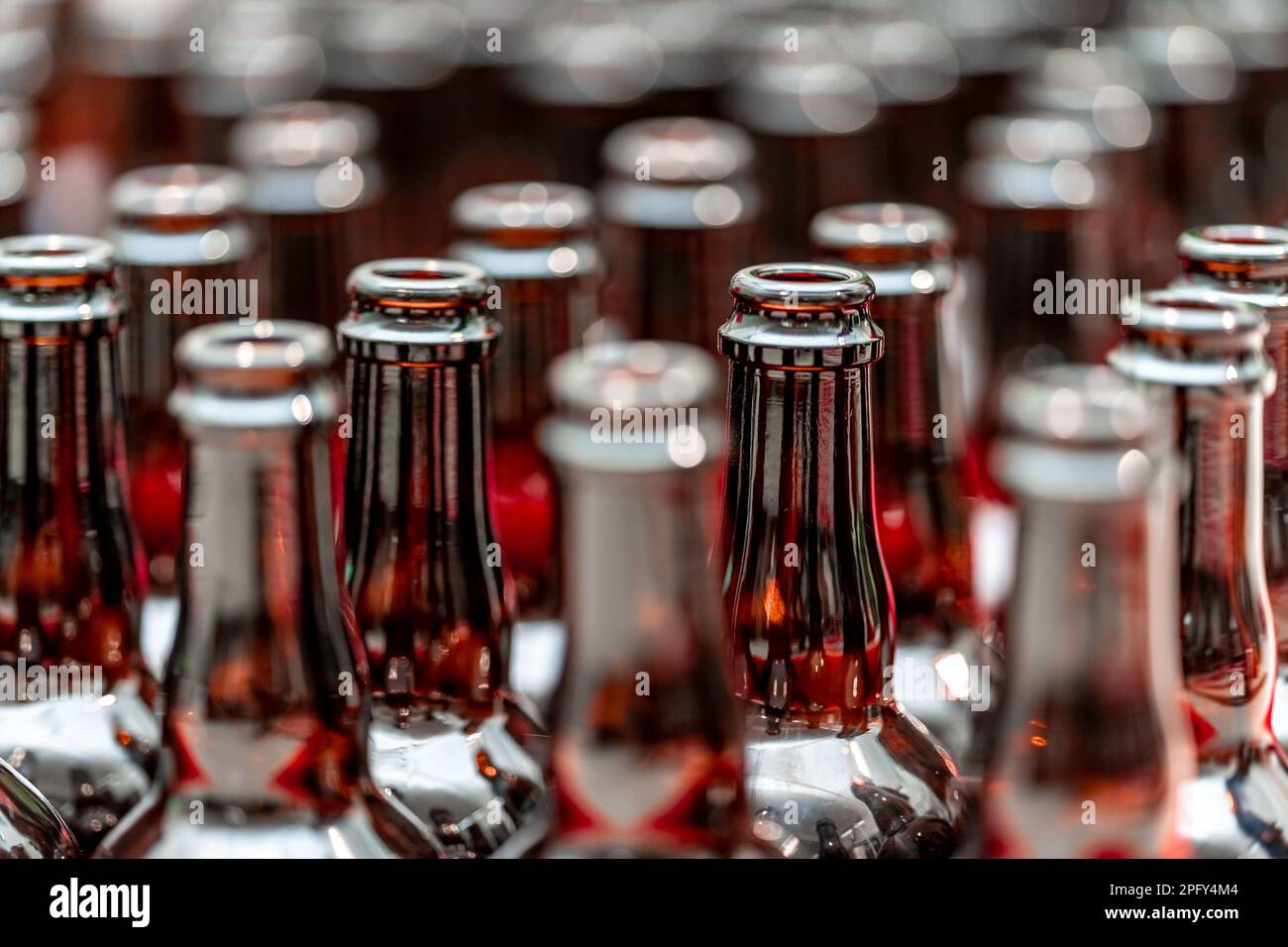 Empty brown bottles in line hi-res stock photography and images - Alamy