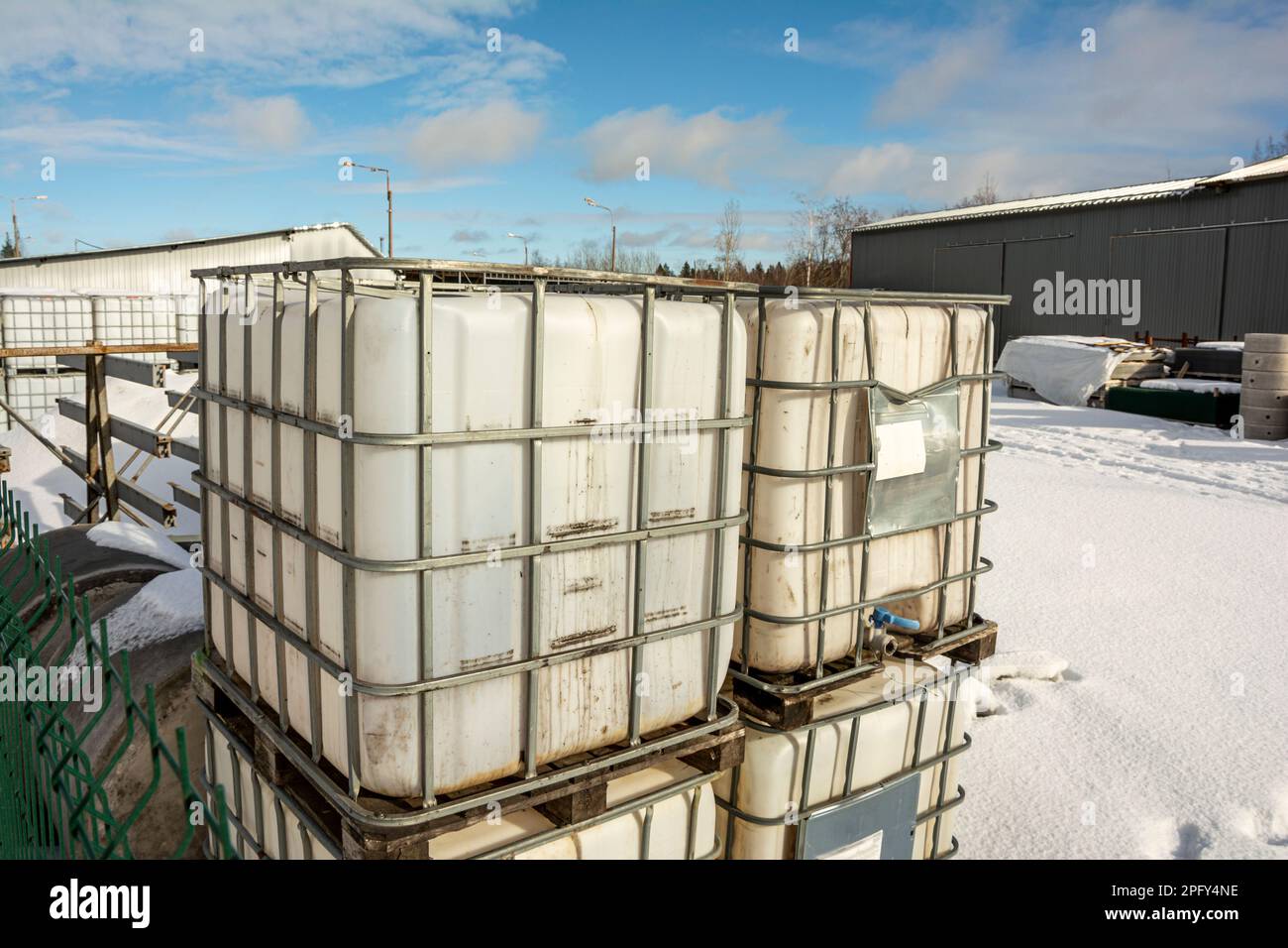 plastic cubic water container protected by a metal grid Stock Photo - Alamy