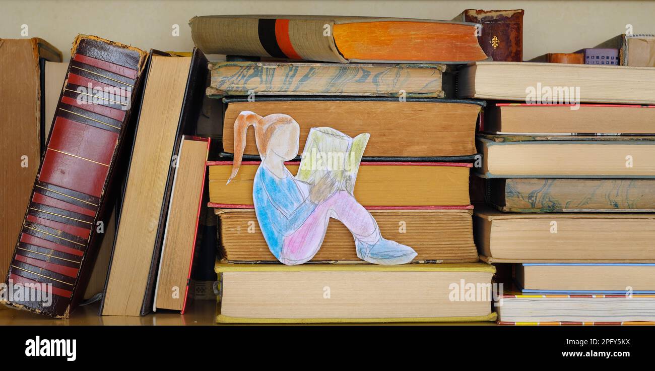 education,learning,knowledge concept,books on a shelf with drawing of a ...