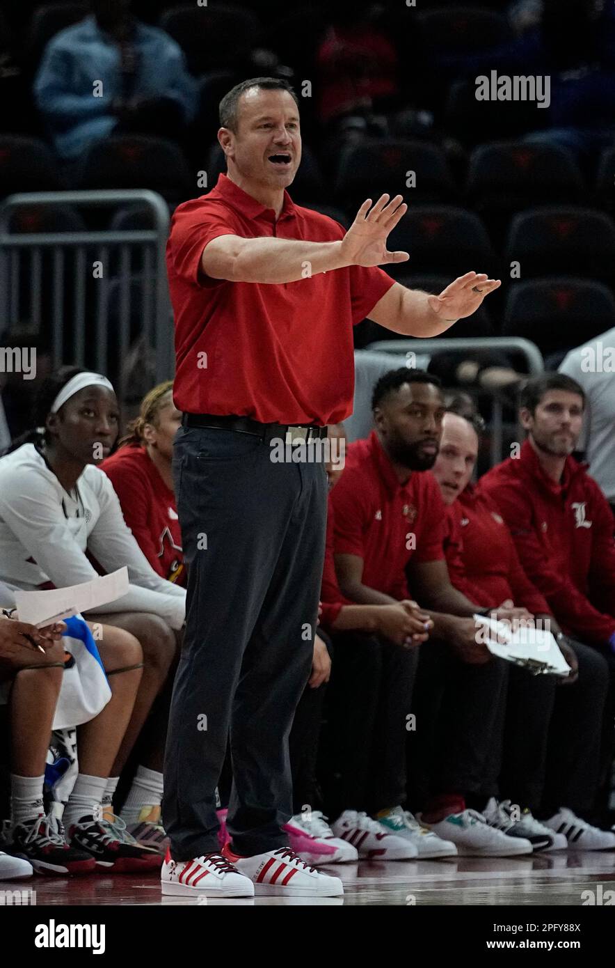 Louisville head coach Jeff Walz directs his players during the first ...