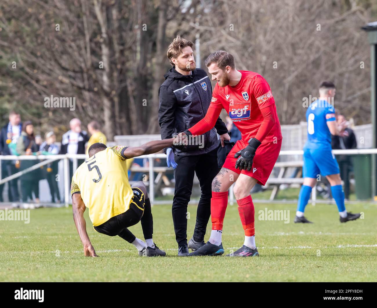 Guisely AFC goalkeeper gives a hand to his injured colleague in the NPL ...