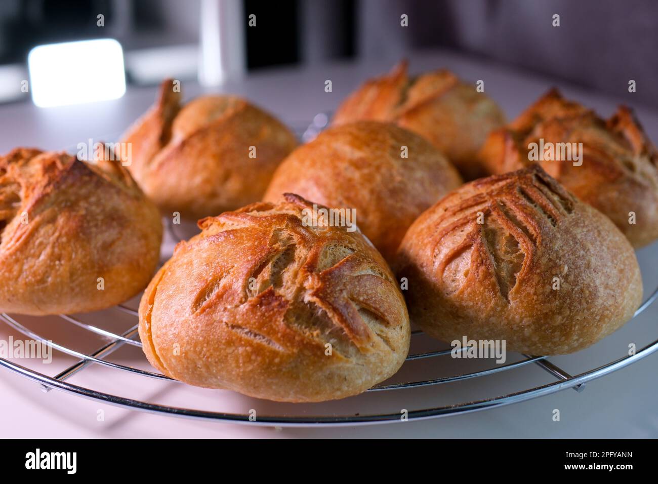 seven buns stand on stand just out of the oven light flashes slowly ...
