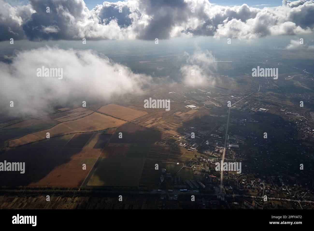 Aerial view from airplane window at high altitude of earth covered with ...