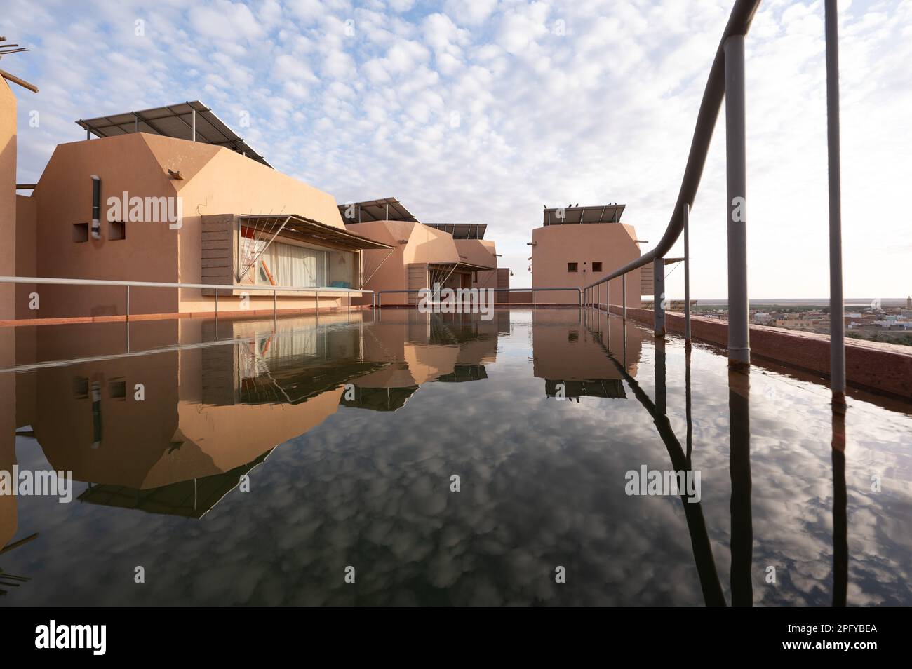 Nefta, Tunisia. 27th Feb, 2023. Clouds are reflected in the pool of the ...