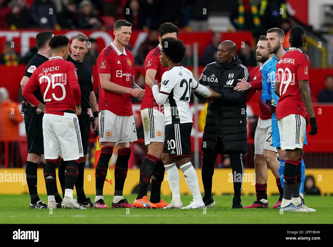 Fulham's Willian (centre) continues to protest after being shown a red ...