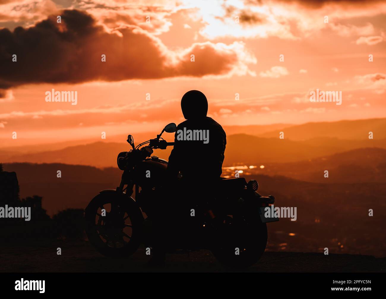 Biker watching sunset hi-res stock photography and images - Alamy
