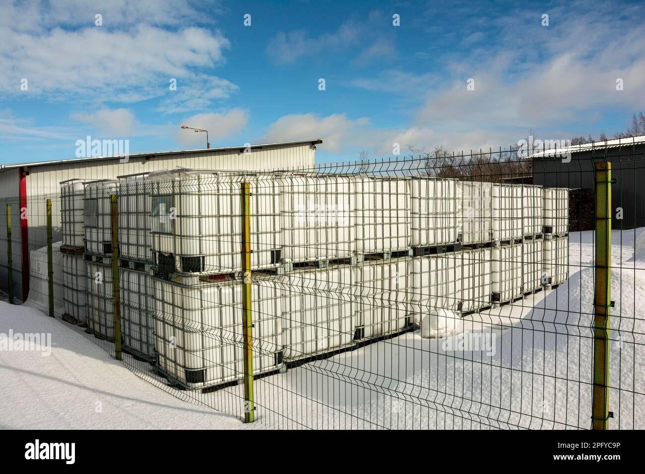 plastic cubic water container protected by a metal grid Stock Photo - Alamy