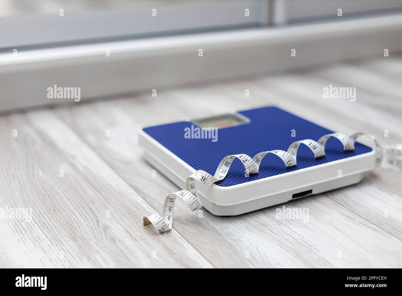 measuring tape taken with a shallow depth of field. personal weight ...