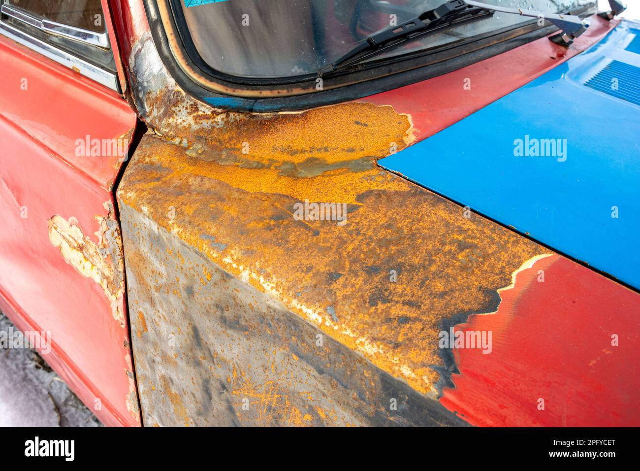 wing of an old rusty car in close-up. the red door, rusty fender Stock ...