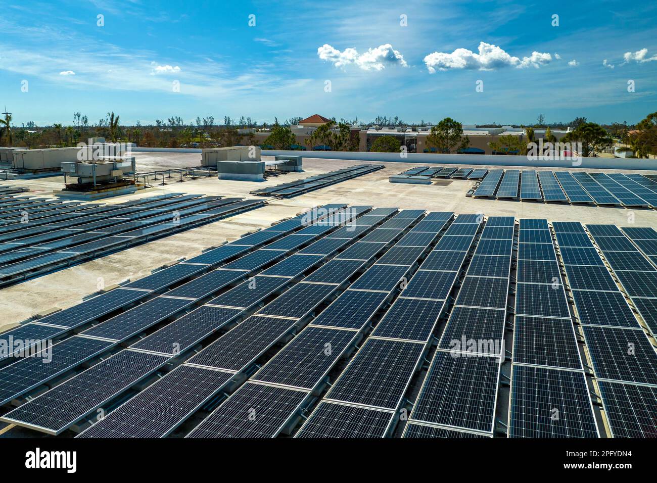 Aerial view of solar power plant with blue photovoltaic panels mounted ...