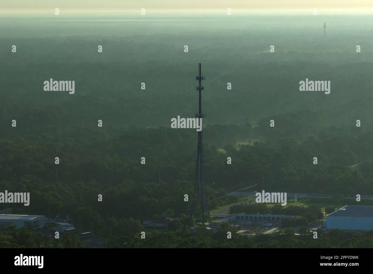 Aerial view of telecommunications cell phone tower with wireless communication 5g antennas for ...