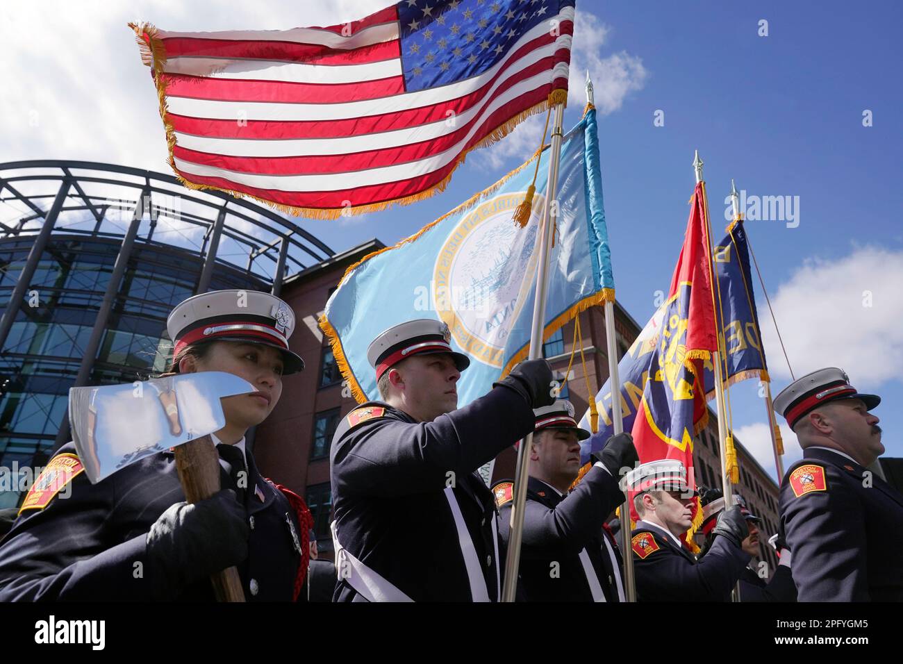 Members of a Boston Fire Department honor guard display flags at the ...