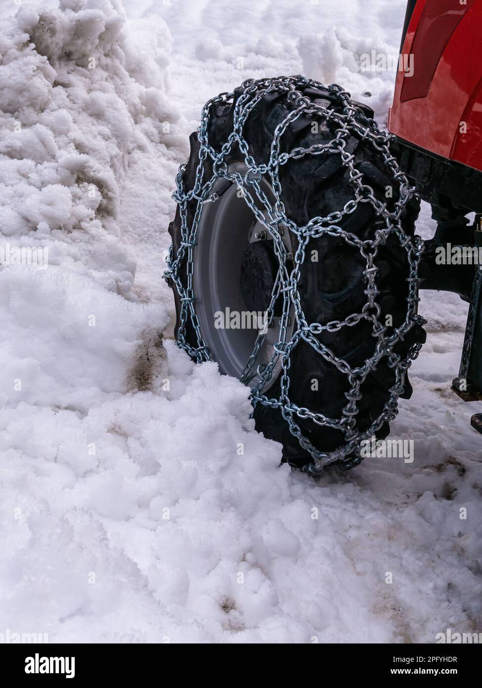 Wheel with snow chains on the vehicle for clearing snowy roads - snow ...