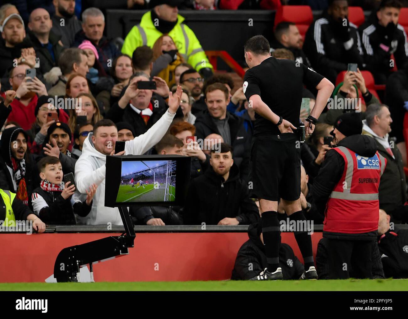 Manchester, UK. 19th Mar, 2023. Referee Chris Kavanagh goes to check ...