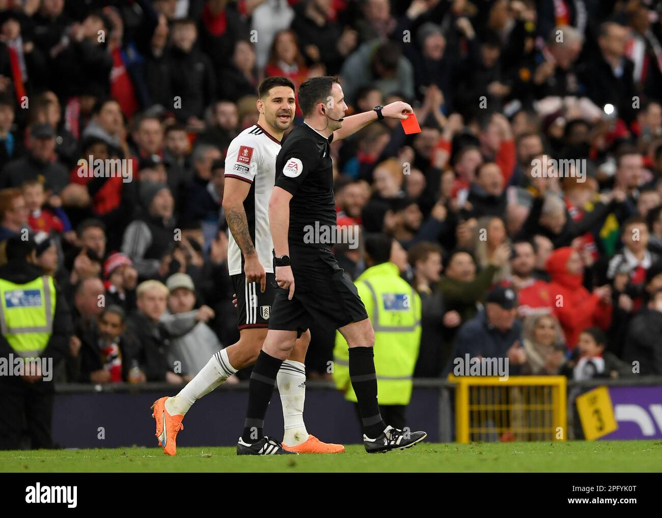 Manchester, UK. 19th Mar, 2023. Referee Chris Kavanagh gives Aleksandar ...