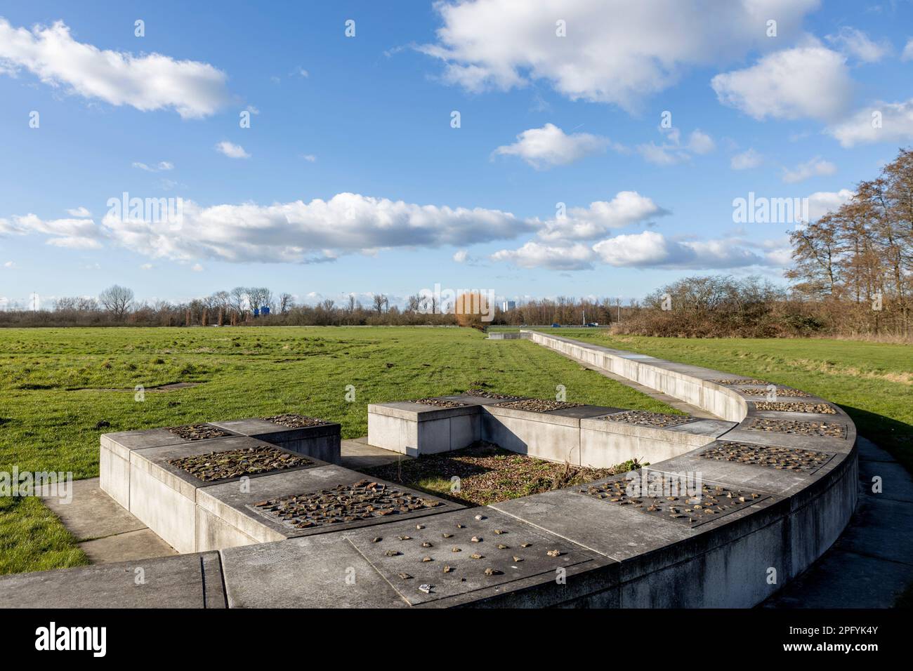 Curved demarcation of historic Roman wall remains with original pieces ...