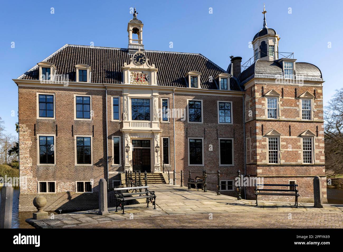 Brick exterior facade and stone bridge access to moated of the Ruurlo ...