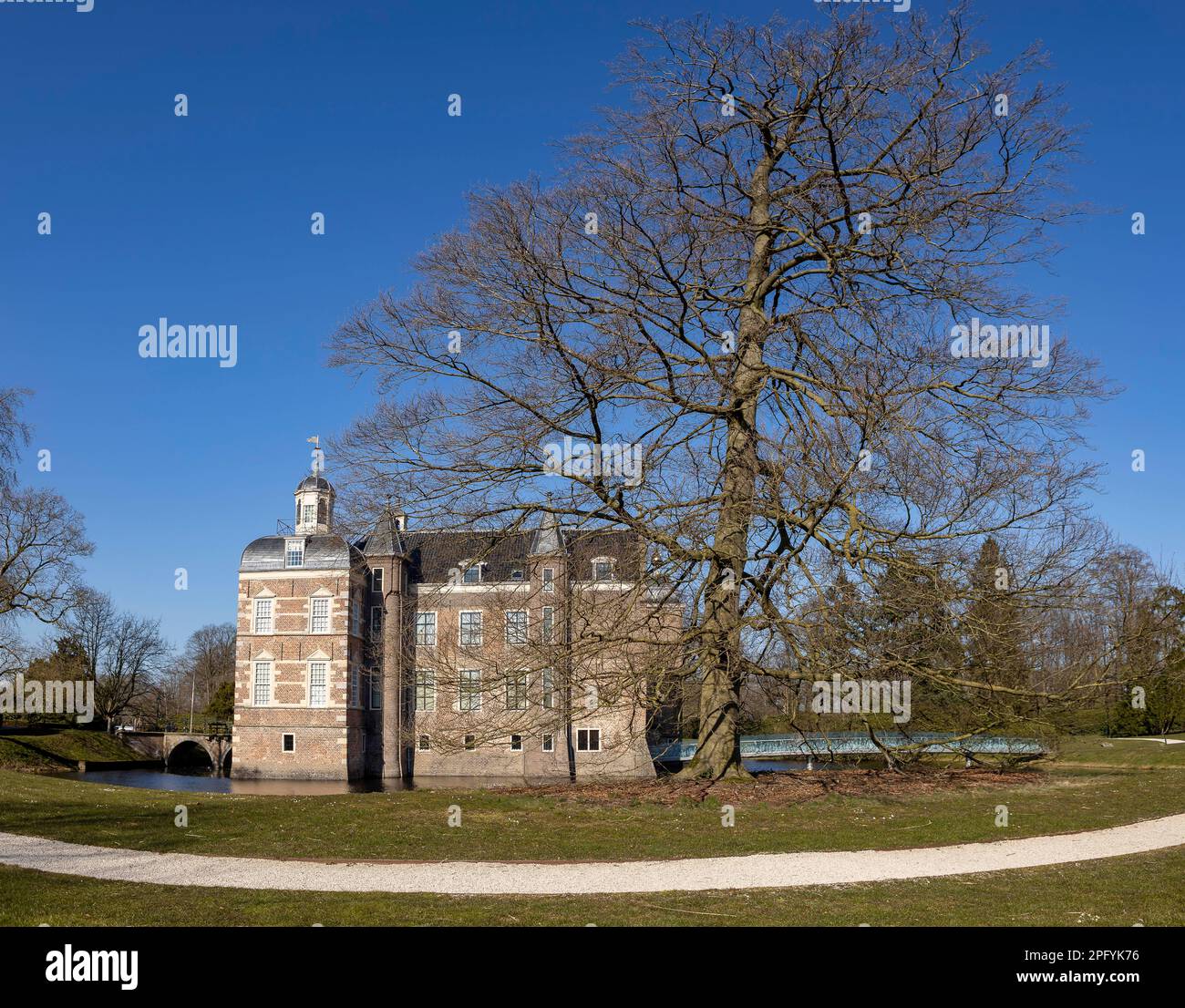 Brightly lit brick exterior facade of the Ruurlo castle with the glass ...
