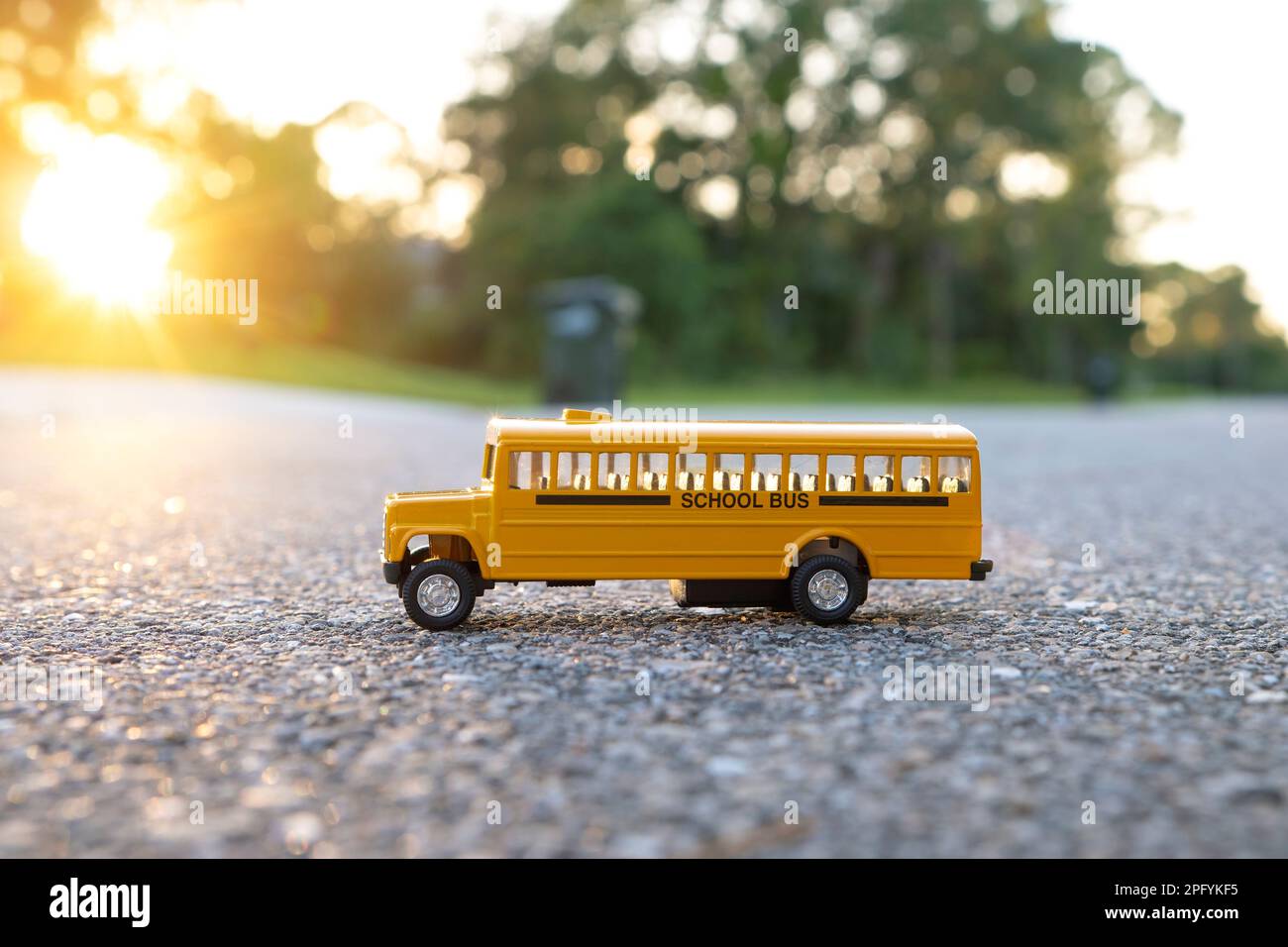 Little model of american yellow school bus outdoor. Concept of ...