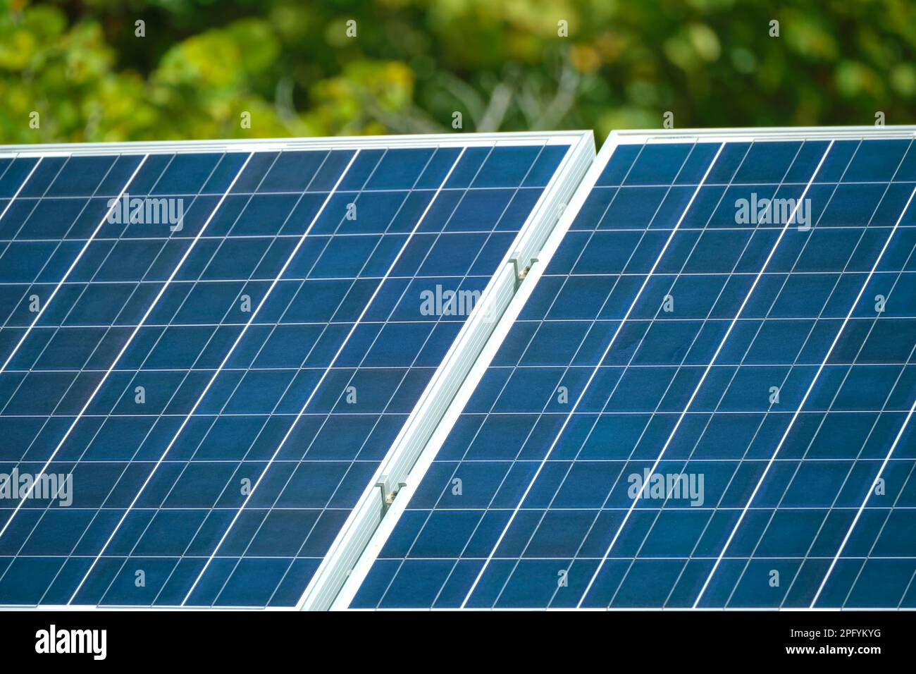 Solar photovoltaic panels mounted on stand-alone frame on backyard ...