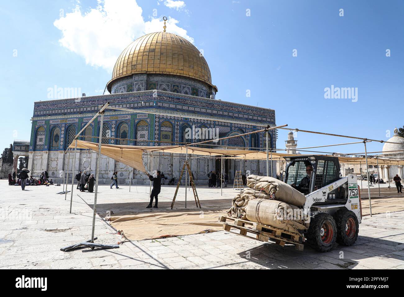A car track seen carrying umbrellas at the courtyards of Al-Aqsa Mosque ...