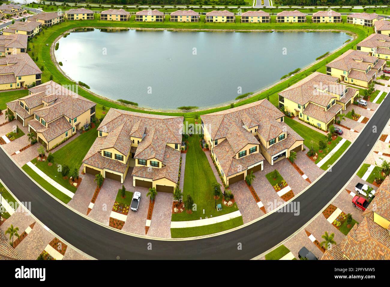 View from above of densely built residential houses near retention ...