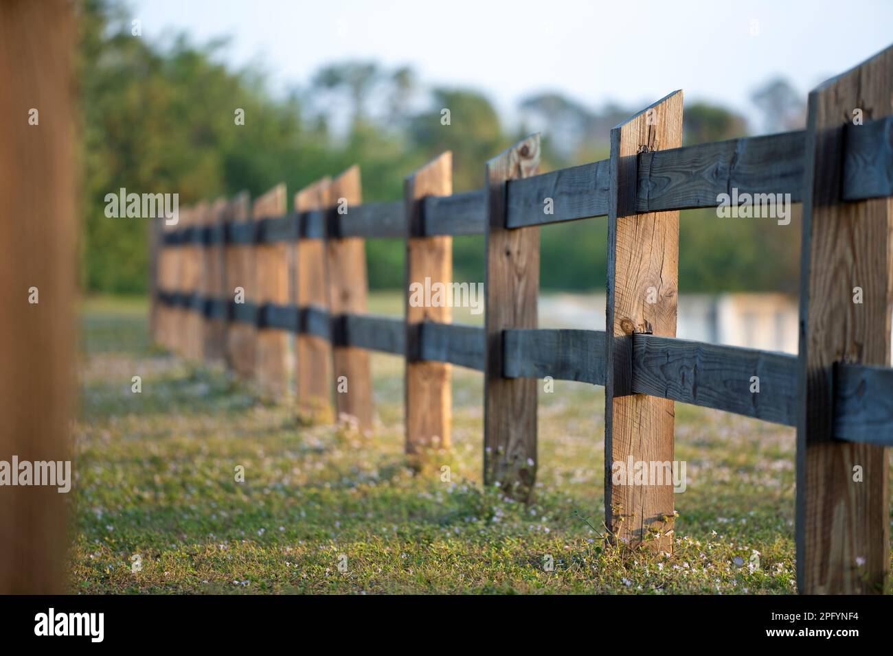 Wooden fence barrier at farm grounds for cattle and territory ...