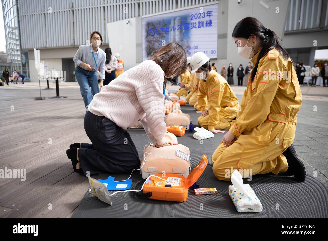 A participant seen performing simulated first aid under supervision of ...