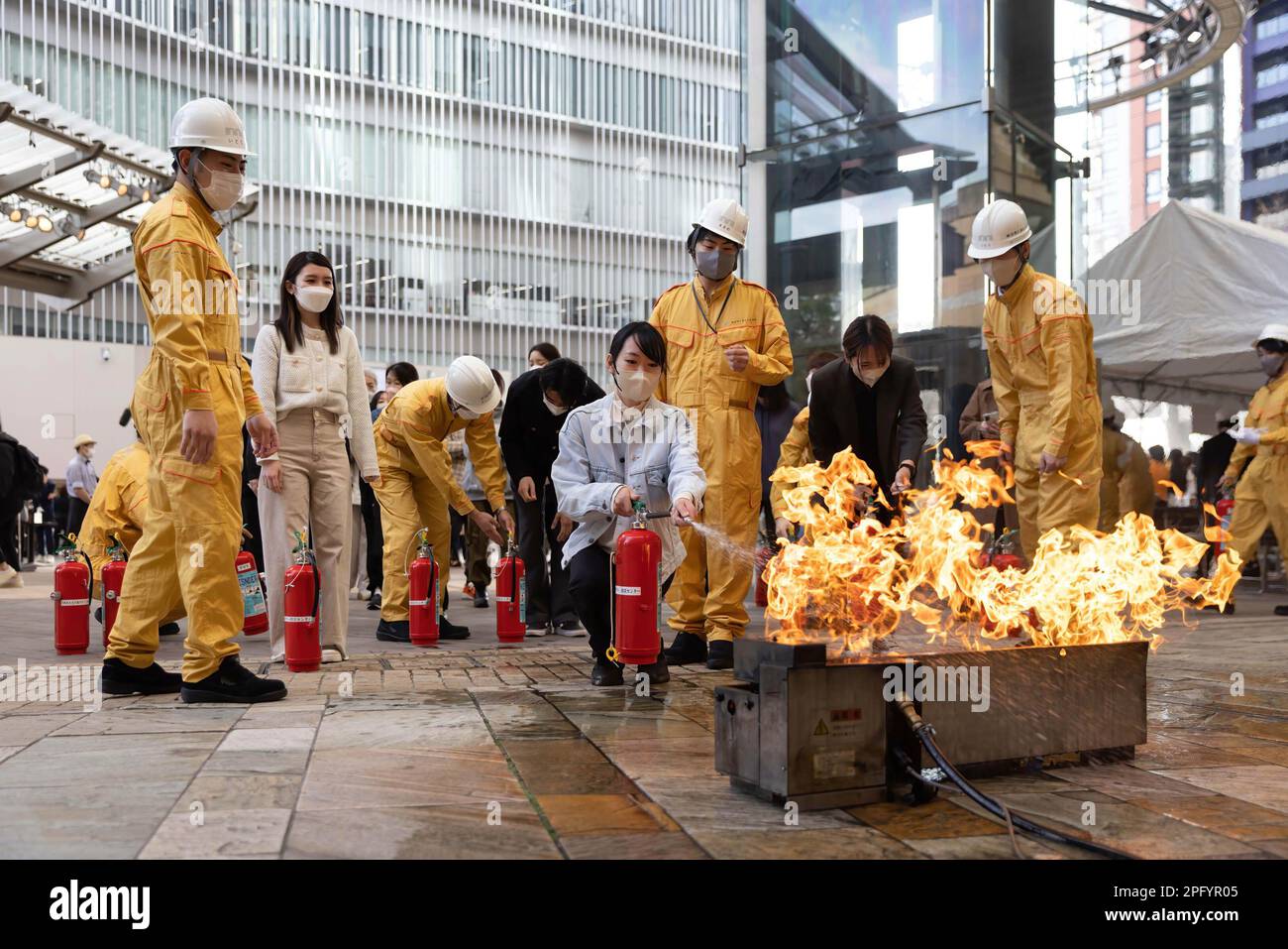 Tokyo, Japan. 10th Mar, 2023. A participant seen extinguishing a fire ...