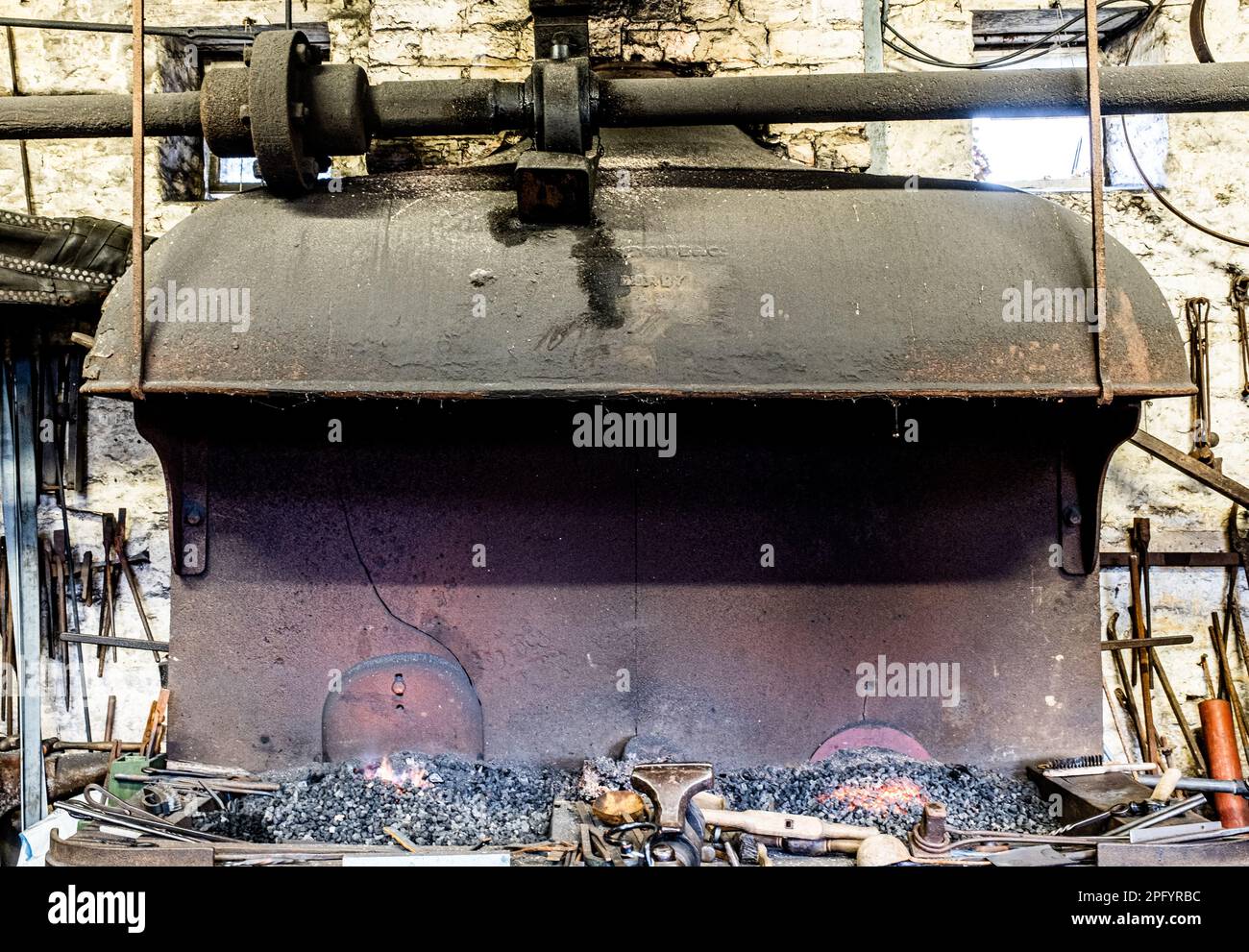 Cracked wraught iron forge hood at Combe Mill Stock Photo - Alamy