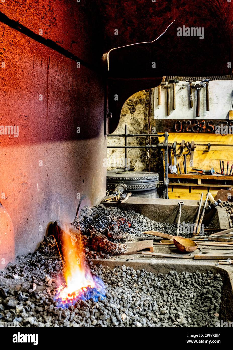 Cracked wraught iron forge hood at Combe Mill Stock Photo - Alamy
