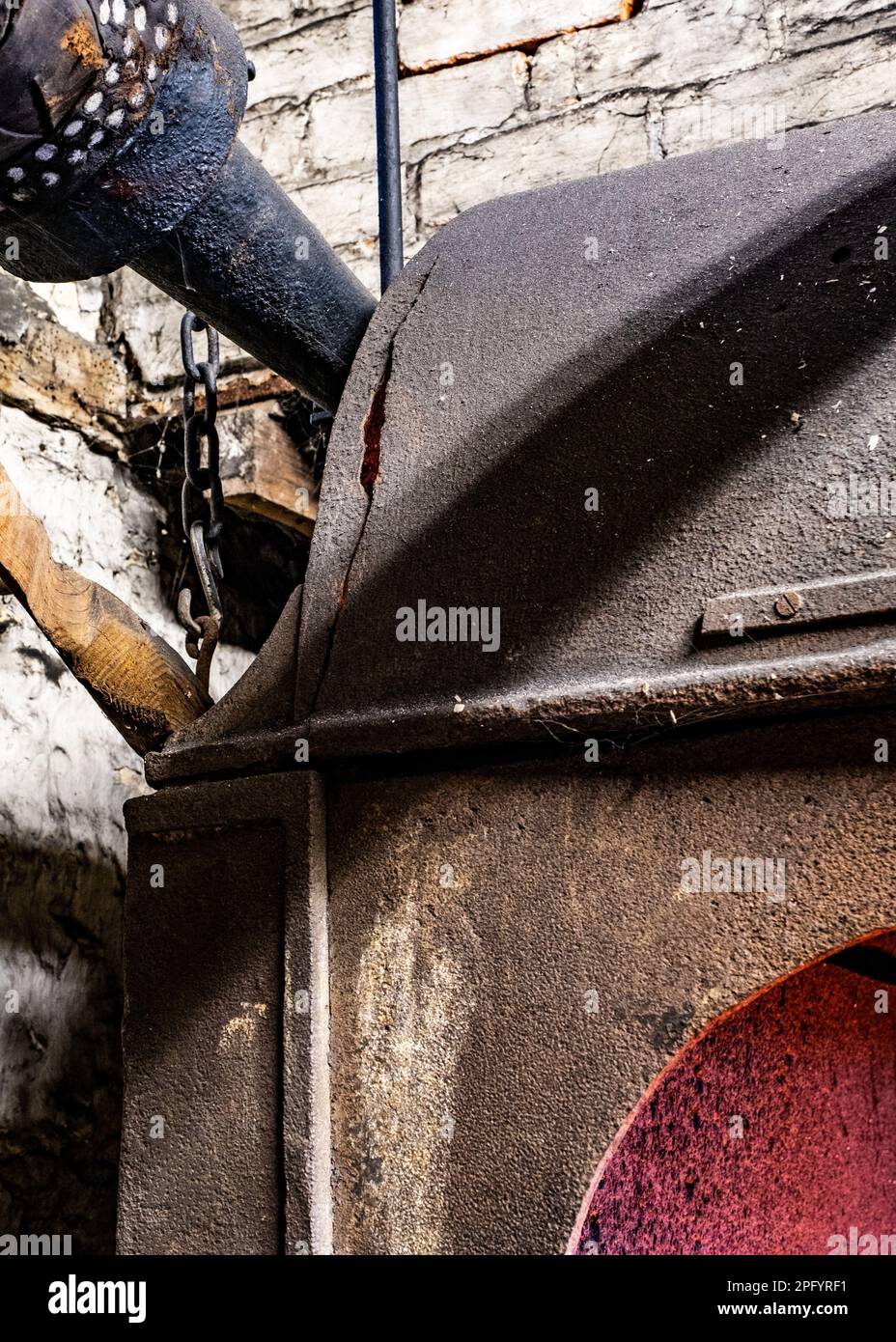 Cracked wraught iron forge hood at Combe Mill Stock Photo - Alamy