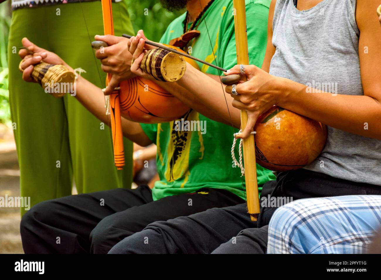 Musicians playing Afro Brazilian percussion musical instruments called ...